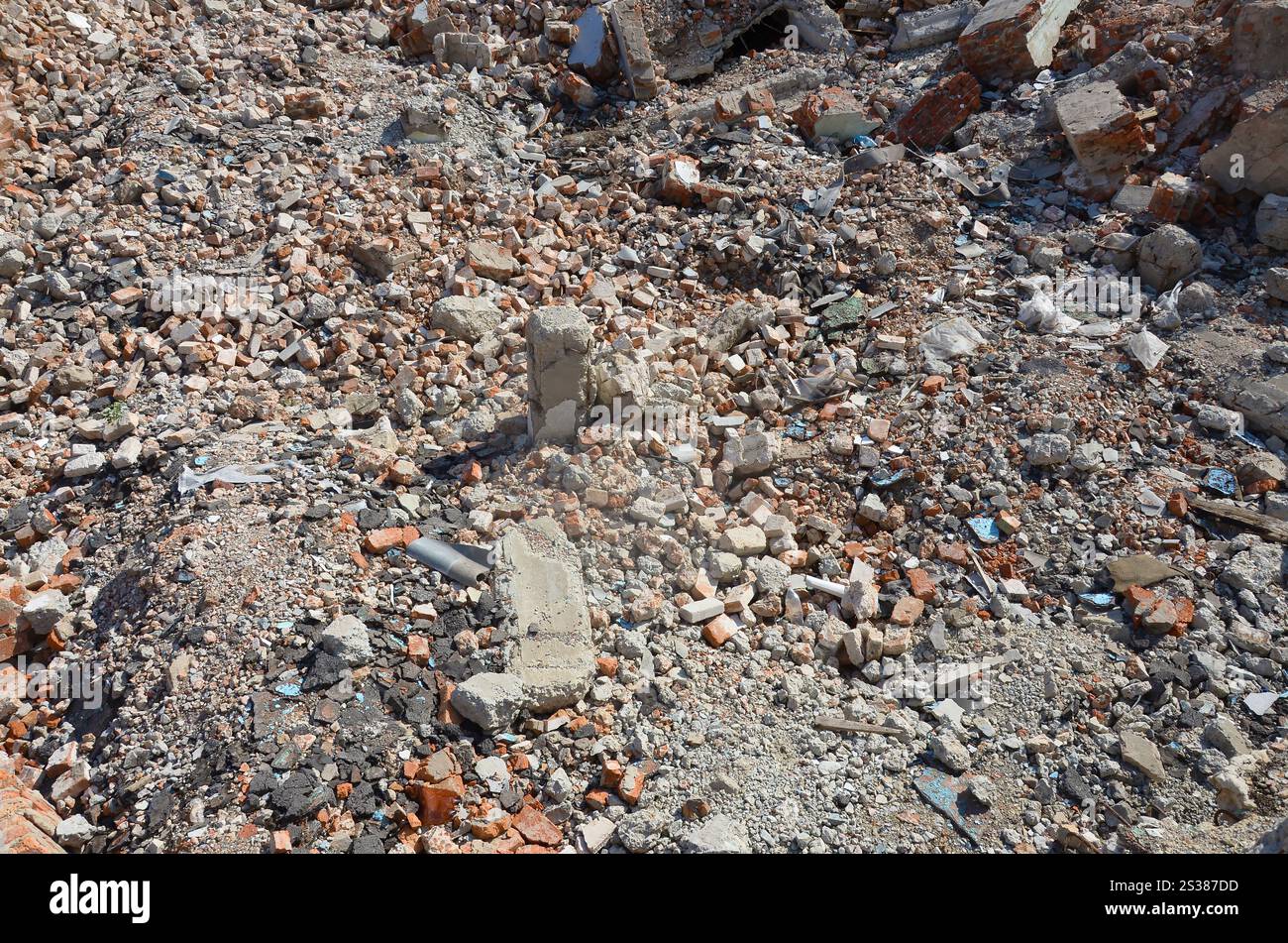 Pile of broken red bricks and fragments of concrete from destroyed ...
