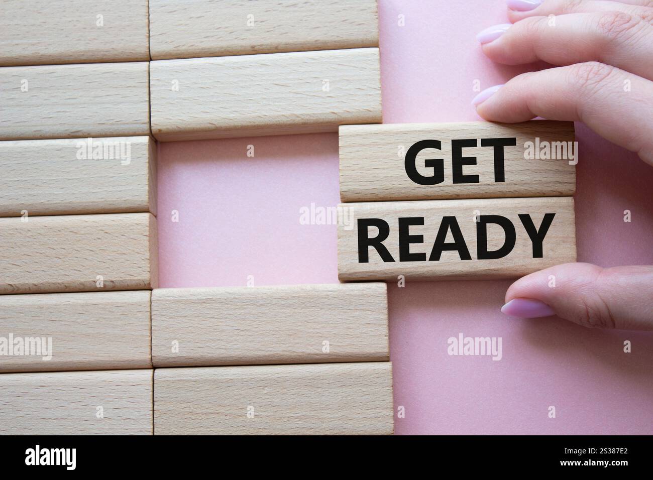 Get ready symbol. Wooden blocks with words Get ready. Beautiful pink ...