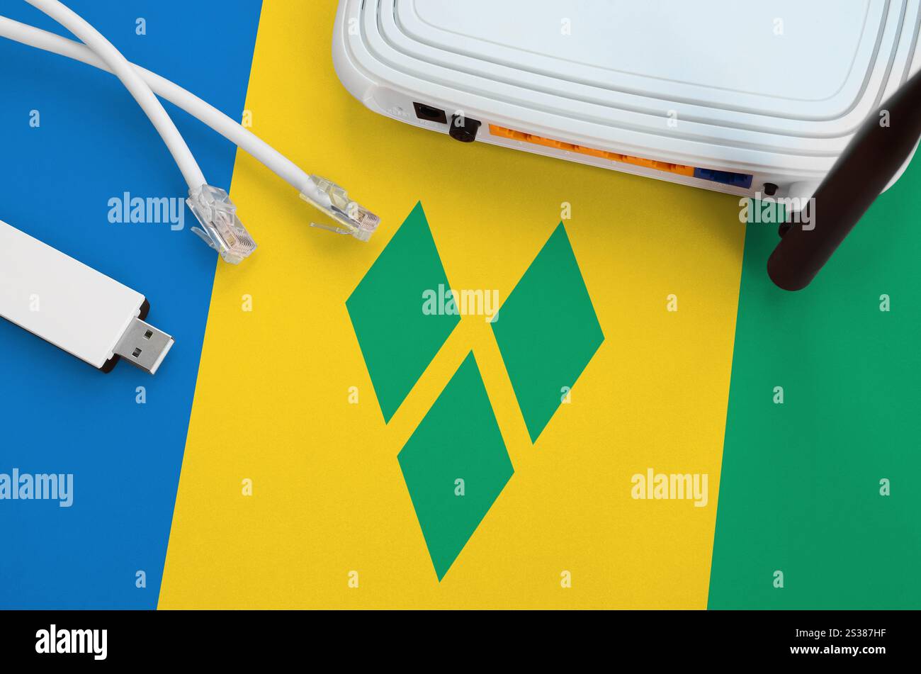 Saint Vincent and the Grenadines flag depicted on table with internet ...
