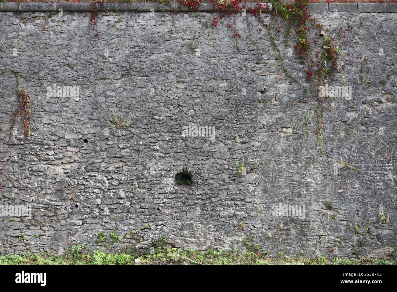 Very old brick stone wall of castle or fortress of 18th century. Full ...