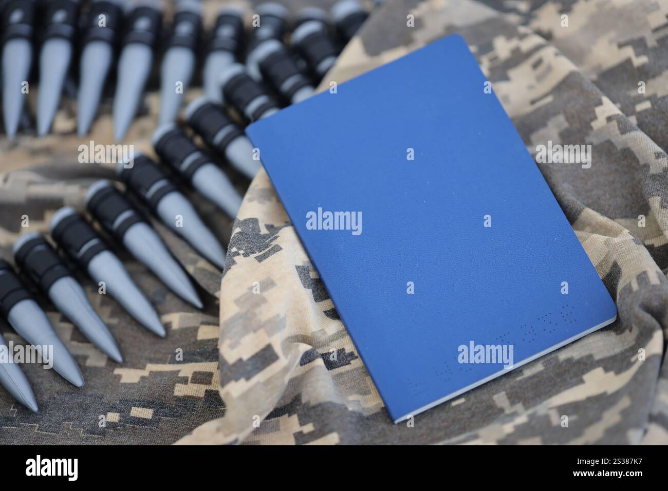 Ukrainian foreign passport on fabric with texture of military pixeled ...