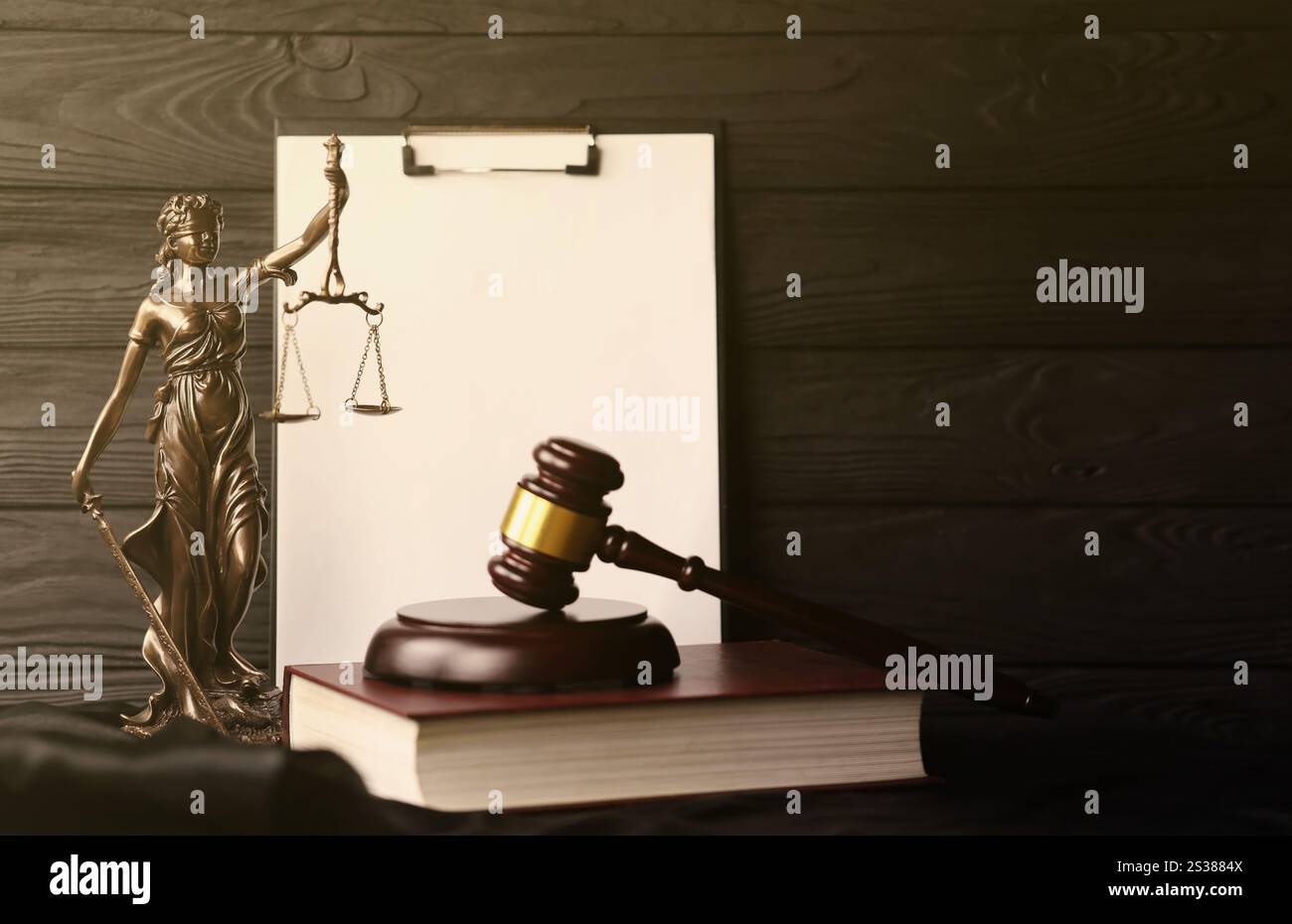 Lady justice or justitia the Roman goddess of Justice. Statue on brown ...