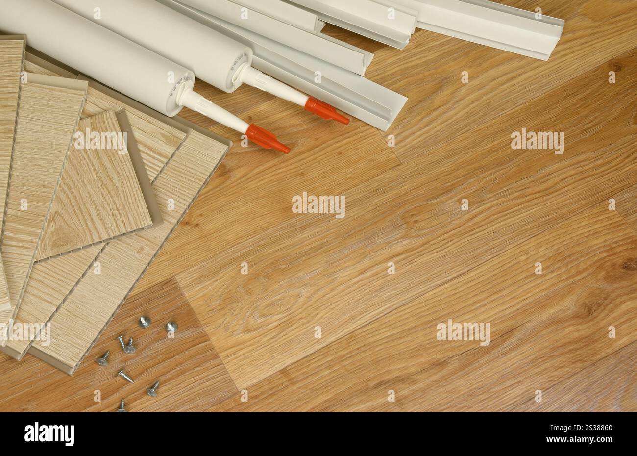 Set of items for PVC ceiling indoor works. Assembly adhesive bottles ...