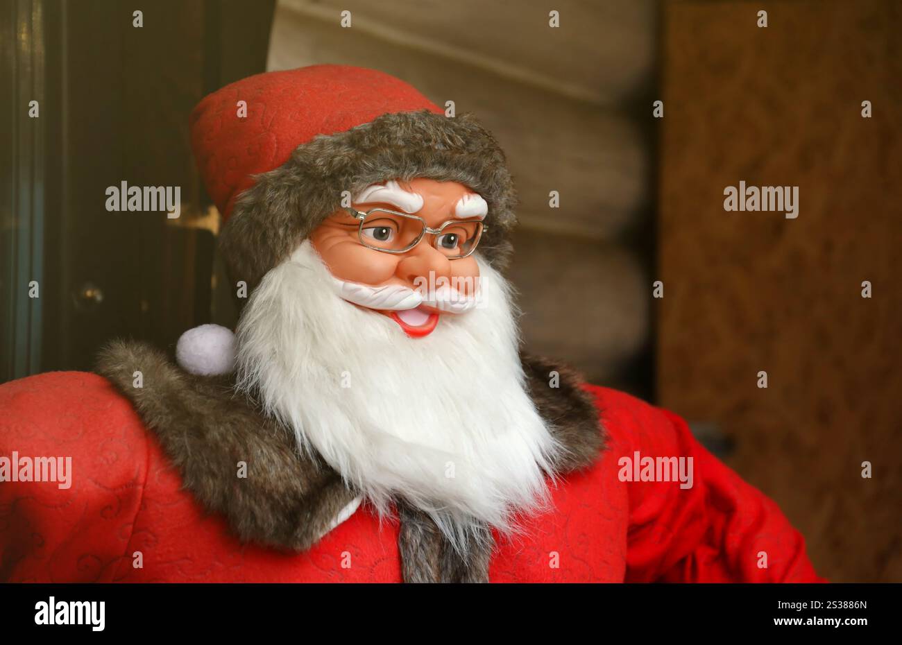 Santa claus big plastic figure with classic santa clothes and hat close ...