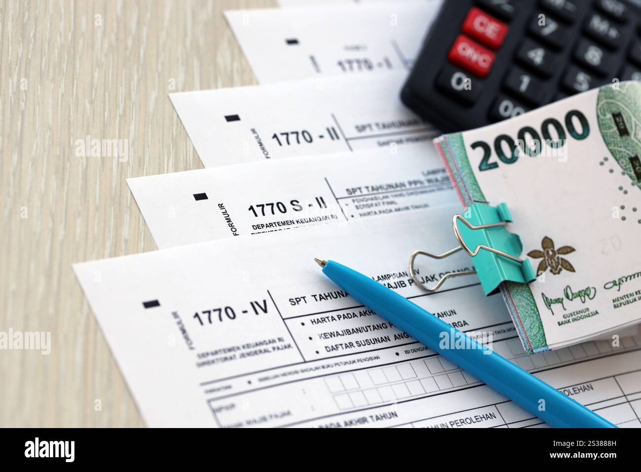 Annual Individual Income Tax Return forms with pen and indonesian ...