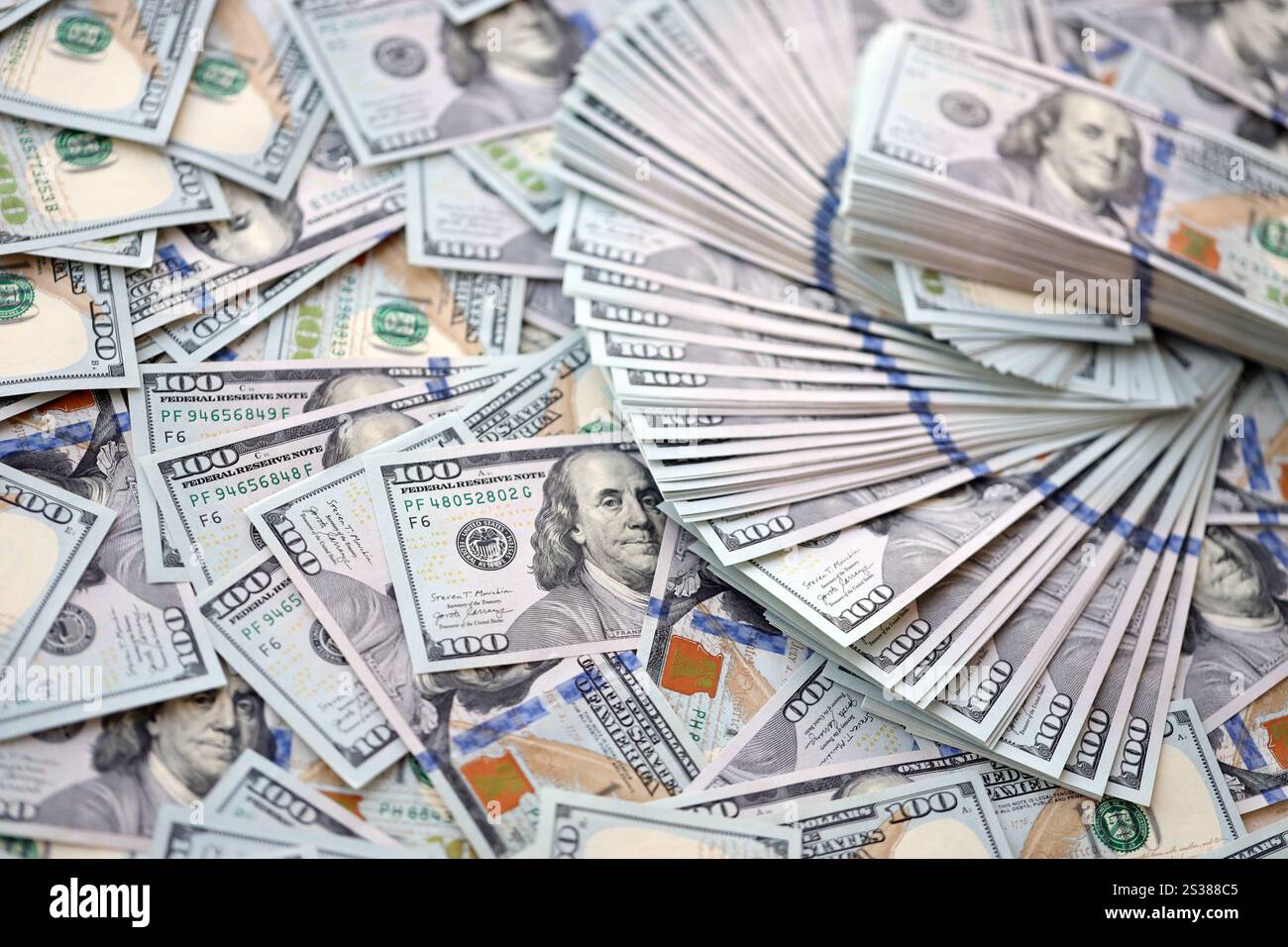 Very big amount of US hundred dollar bills close up. Huge quantity of ...