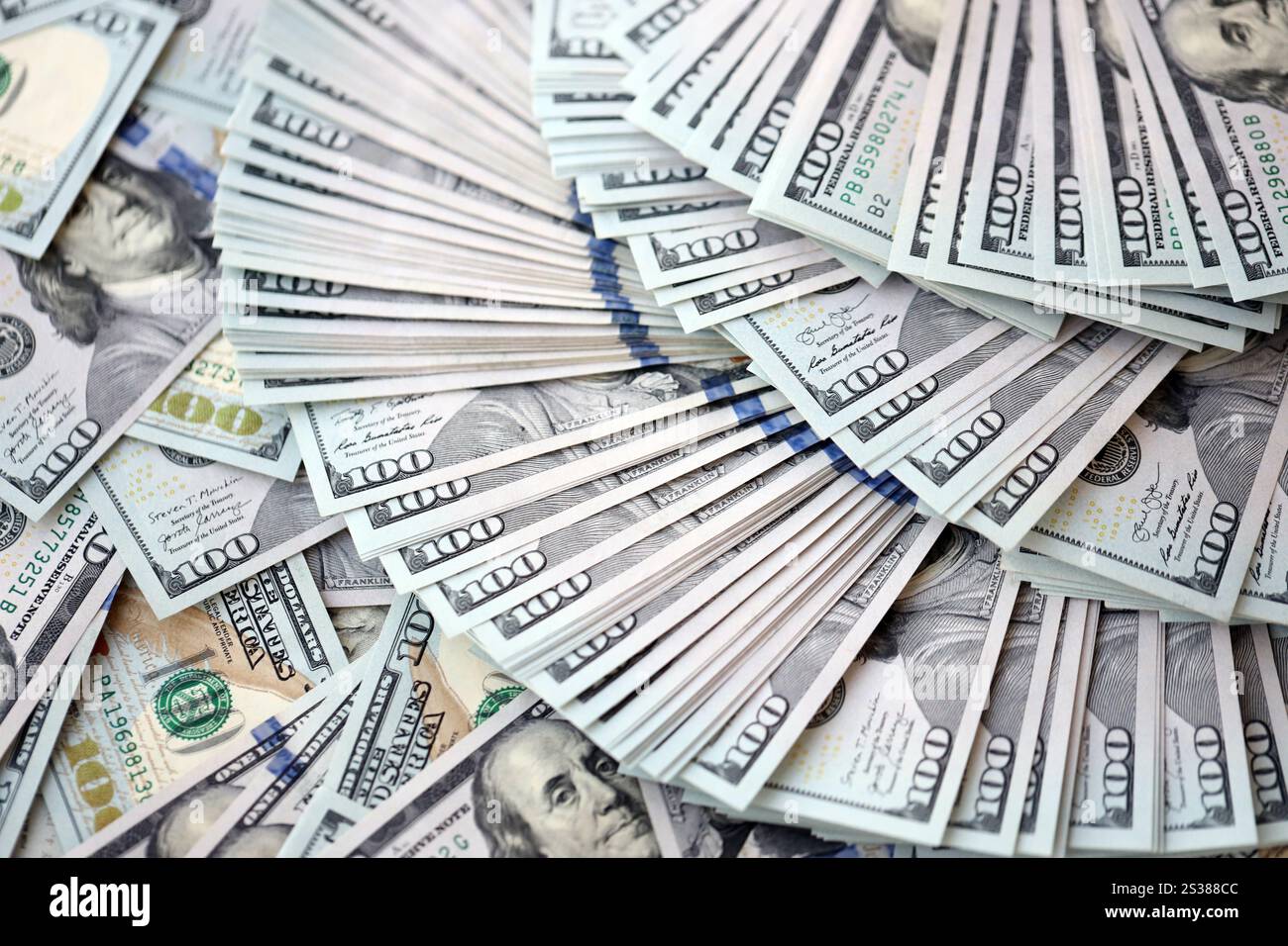 Very big amount of US hundred dollar bills close up. Huge quantity of ...