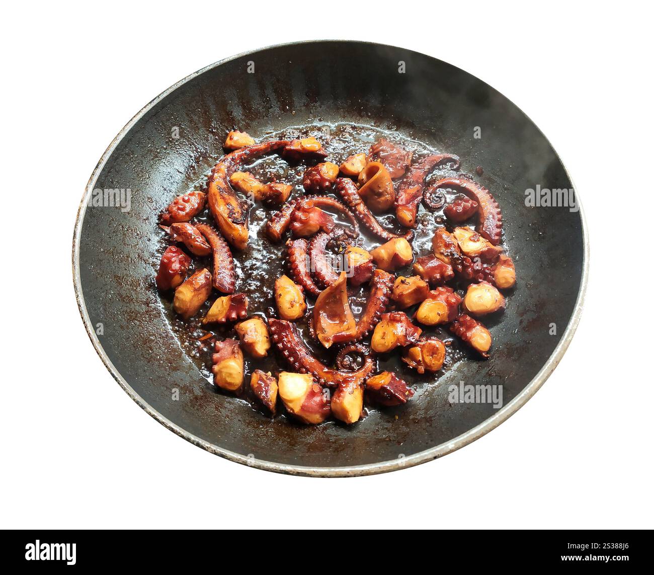 Classic cooking octopus in the village. Boiling and frying clam ...