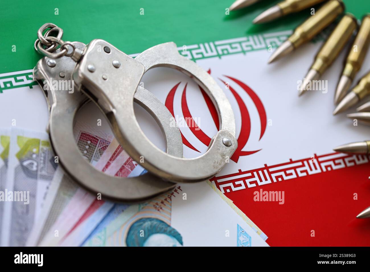 Iran flag and police handcuffs with iranian money bills rials. The ...