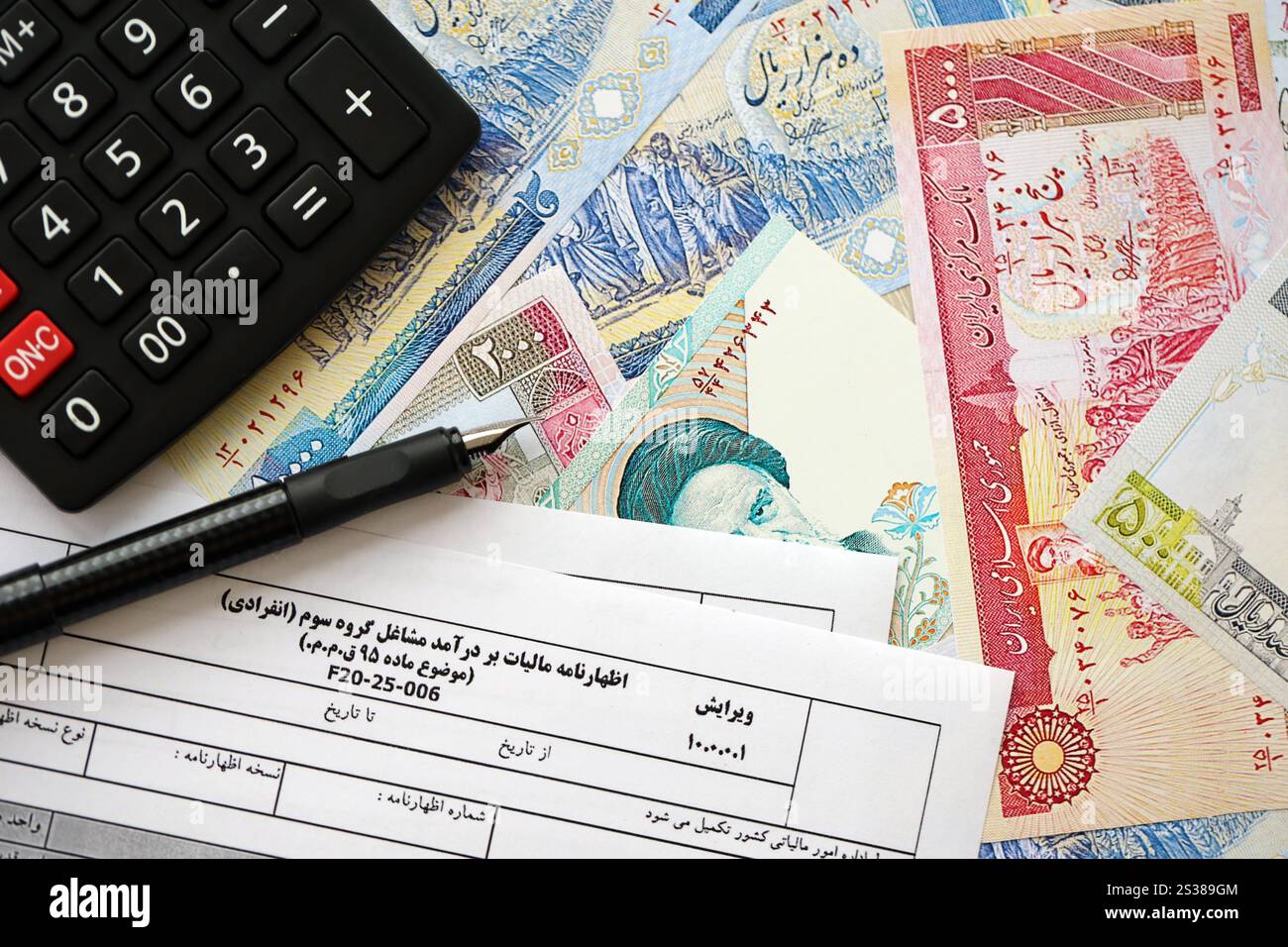 Iranian annual income tax return form F20-25-006 ready to fill on table ...