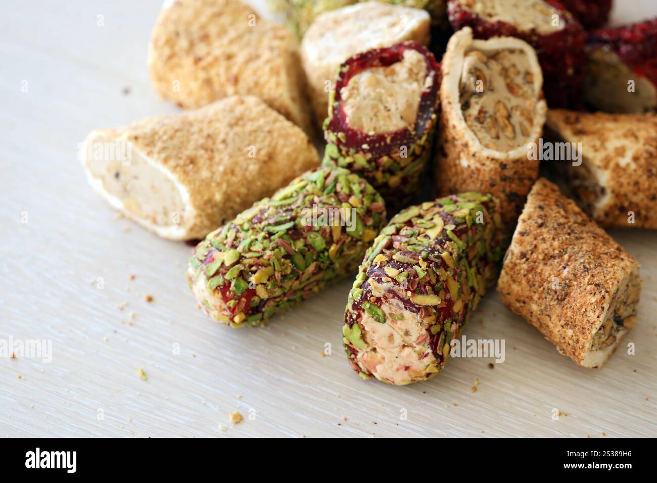 Rolls of turkish delight with different flavors and fillings close up ...