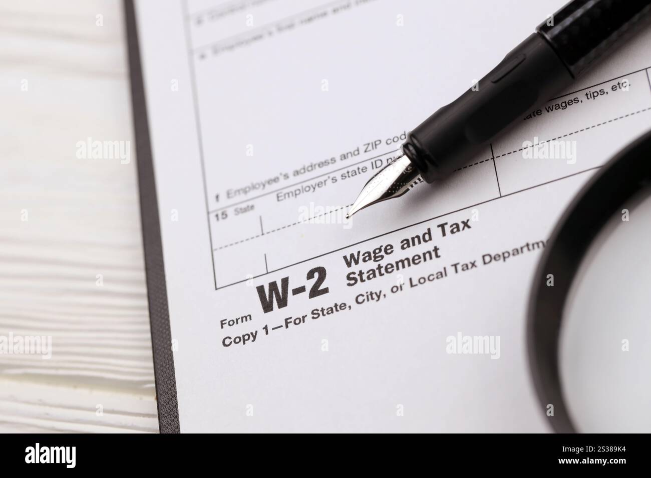 IRS Form W-2 Wage and Tax Statement blank on A4 tablet lies on office ...