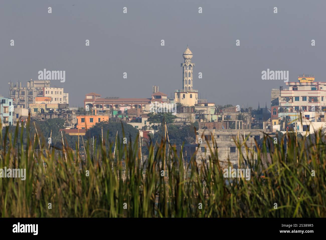 Beautiful view of Dhaka city with buildings and natural grass field ...