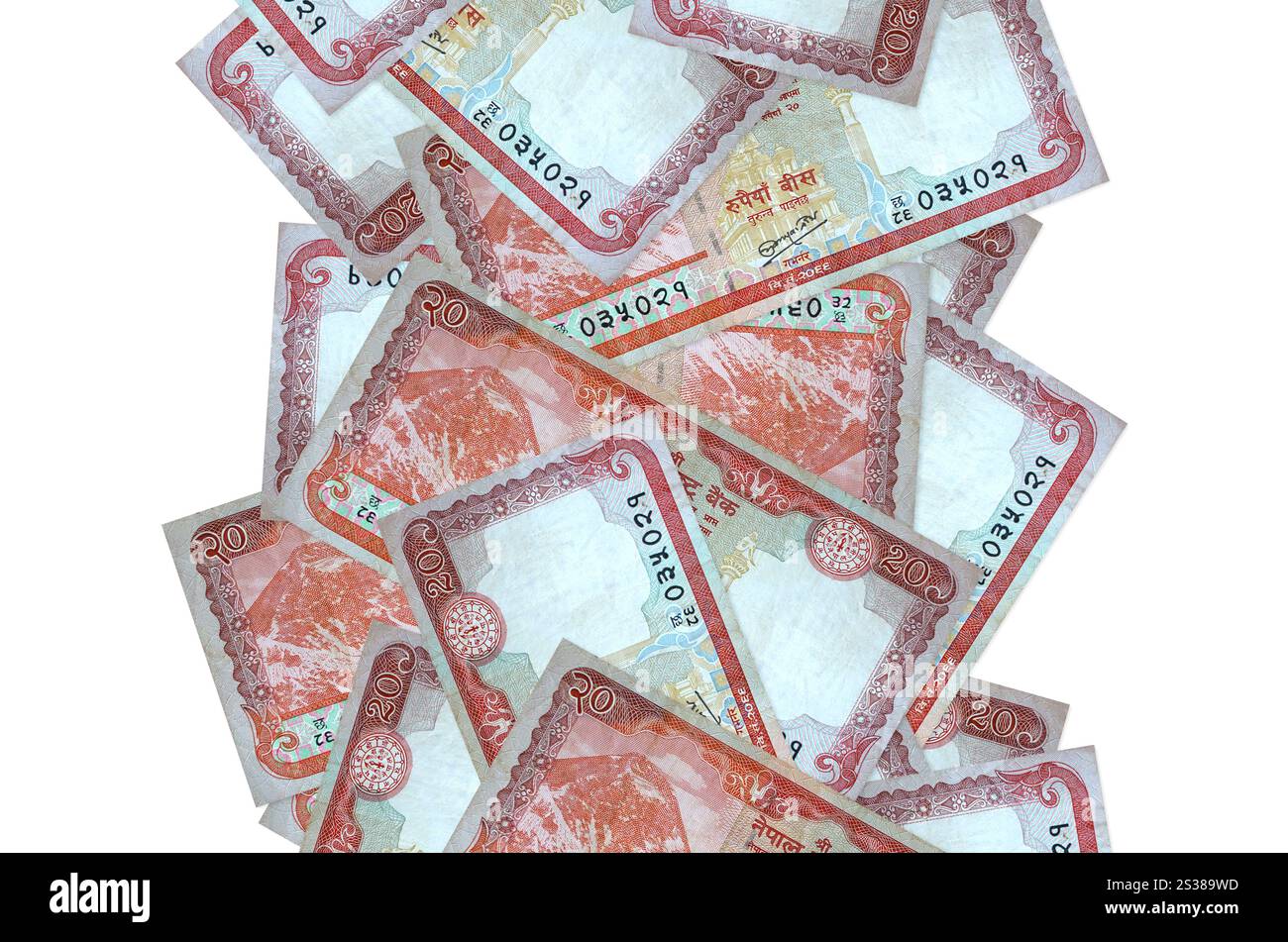 20 Nepalese rupees bills flying down isolated on white. Many banknotes ...
