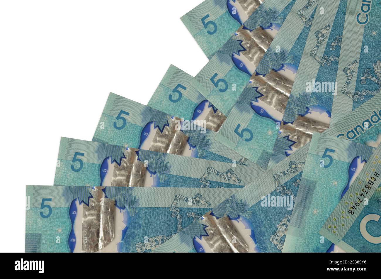 5 Canadian dollars bills lies in different order isolated on white ...