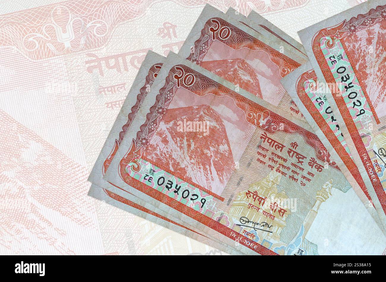 20 Nepalese rupees bills lies in stack on background of big semi ...