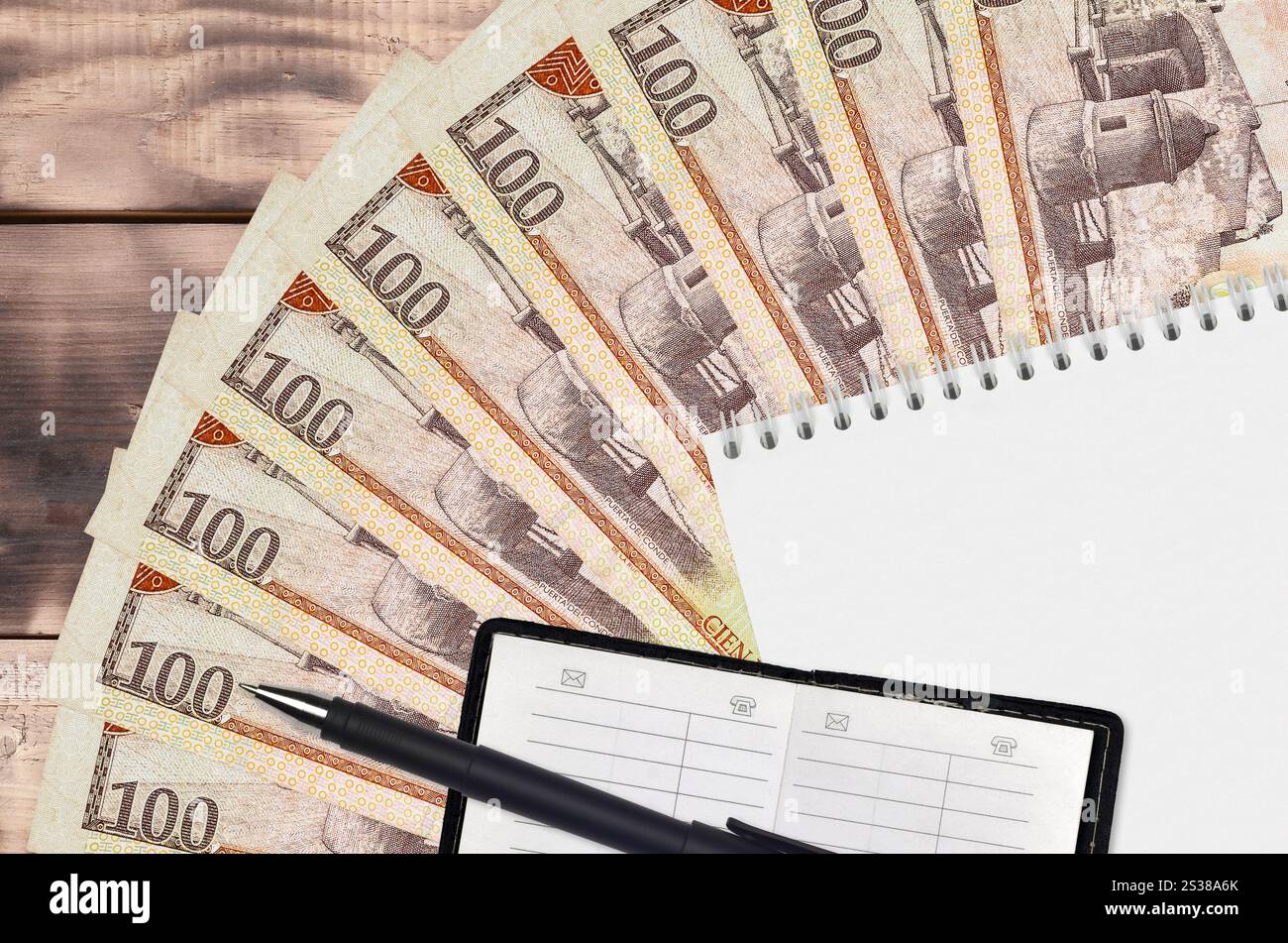100 Dominican peso bills fan and notepad with contact book and black ...