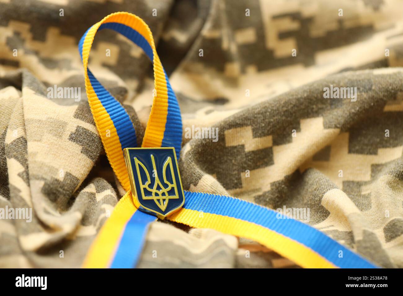 Pixeled digital military camouflage fabric with ukrainian flag and coat ...