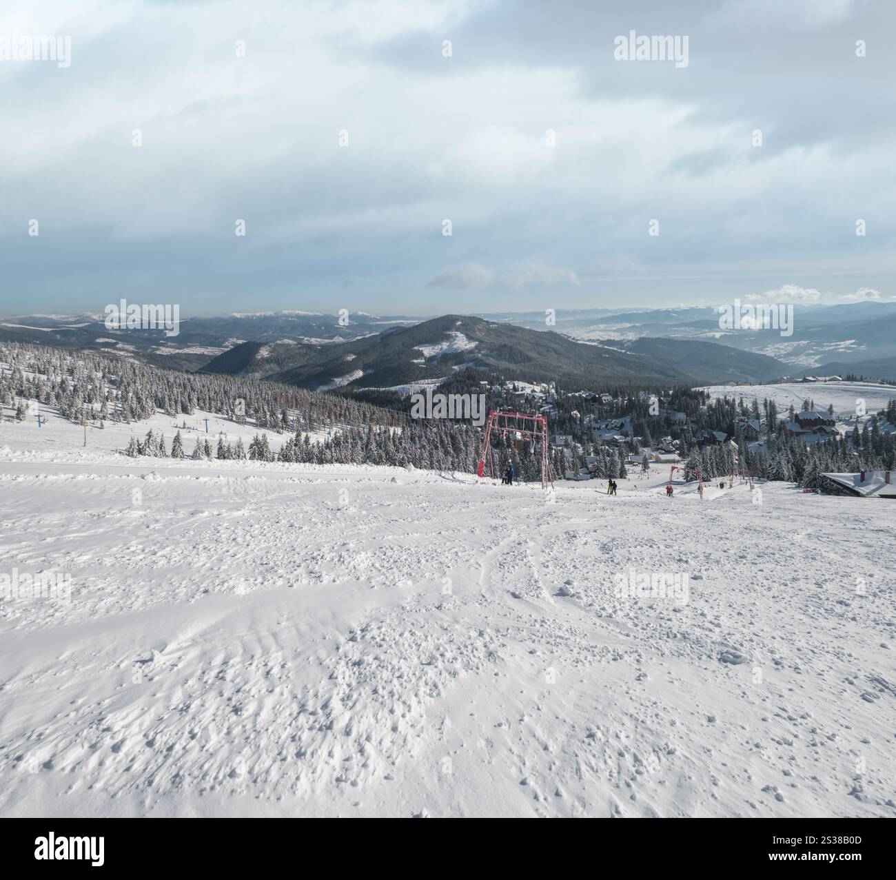 Winter snow covered mountain ski resort slope . Magnificent sunny day ...