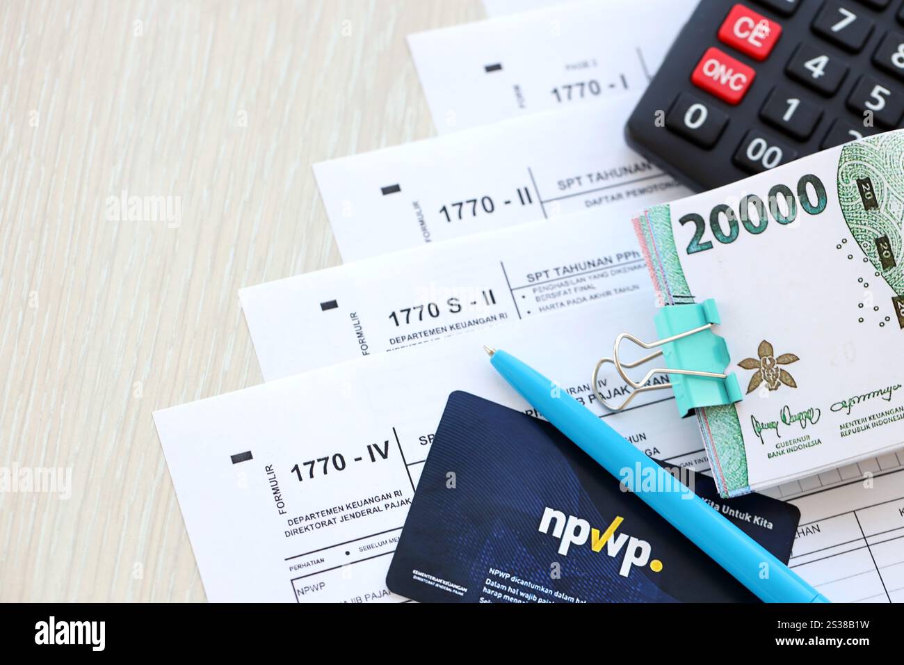 Annual Individual Income Tax Return forms with pen and indonesian ...