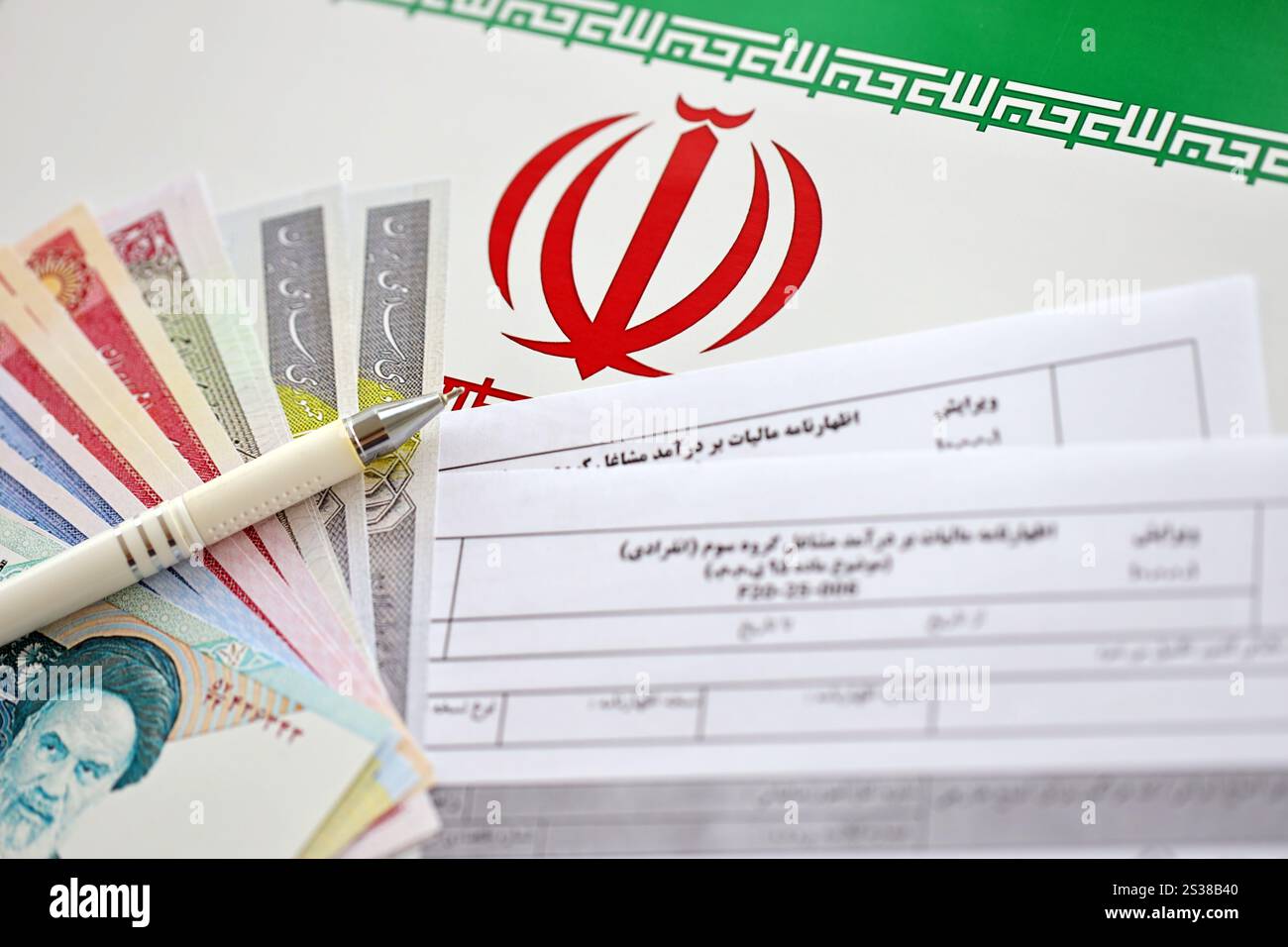 Iranian annual income tax return form F20-25-006 ready to fill on table ...