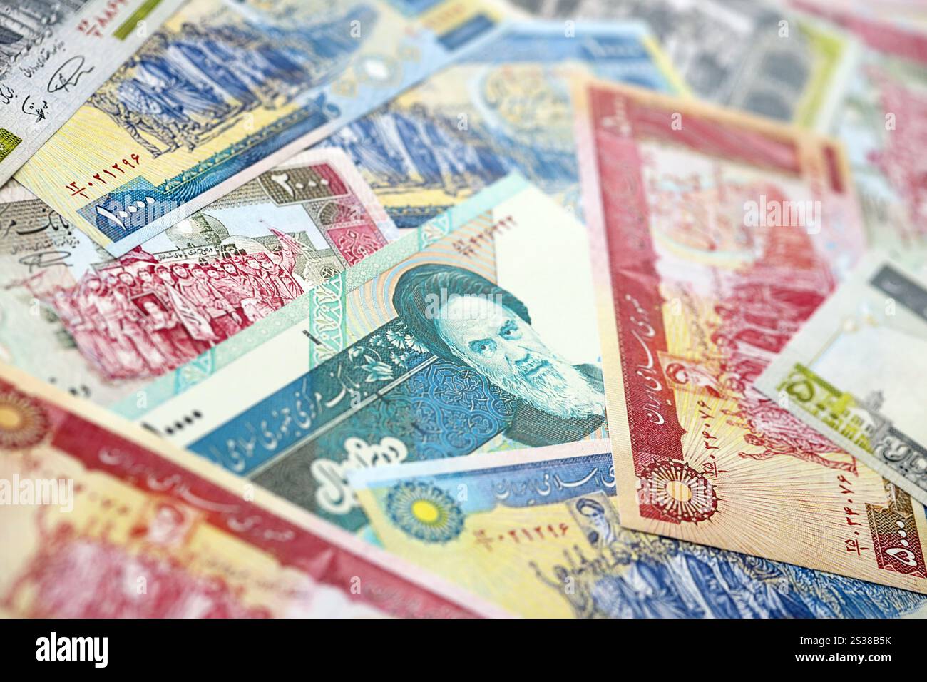 Big pile of Iranian Rial IRR banknotes from Iran as the background on ...