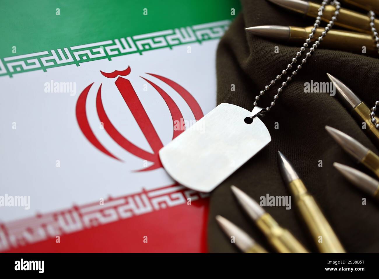 Many rifle bullets and dog tags with flag of Islamic Republic of Iran ...
