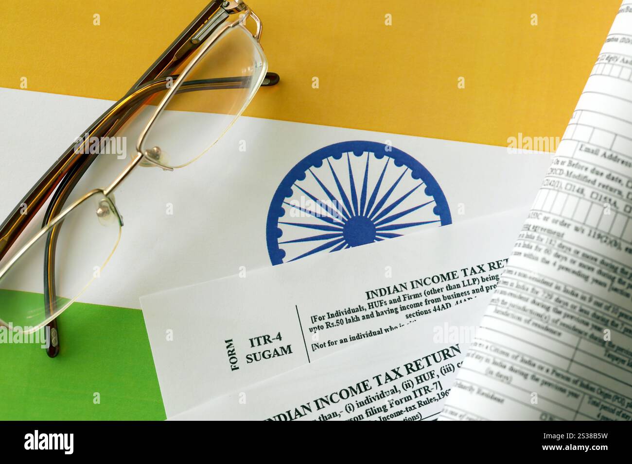 Indian income tax return blank form with pen and indian rupees bills on ...