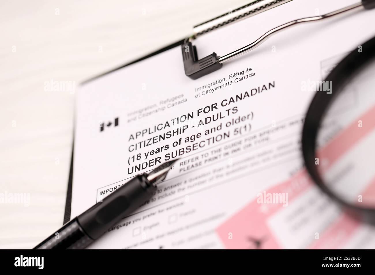 Application for Canadian citizenship for adults on A4 tablet lies on ...