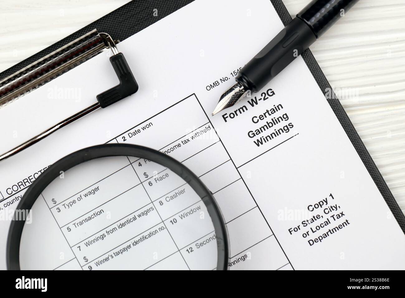 IRS Form W-2G Certain Gambling Winning blank on A4 tablet lies on ...