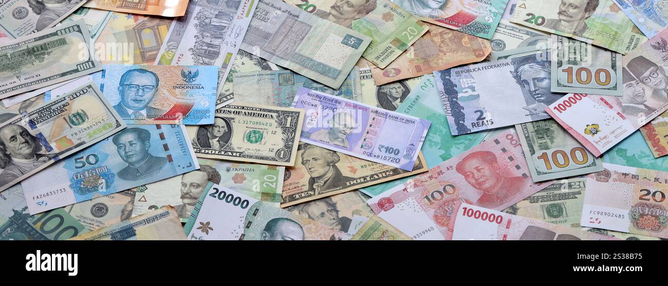 Many banknotes of different currency. Background of big amount of ...