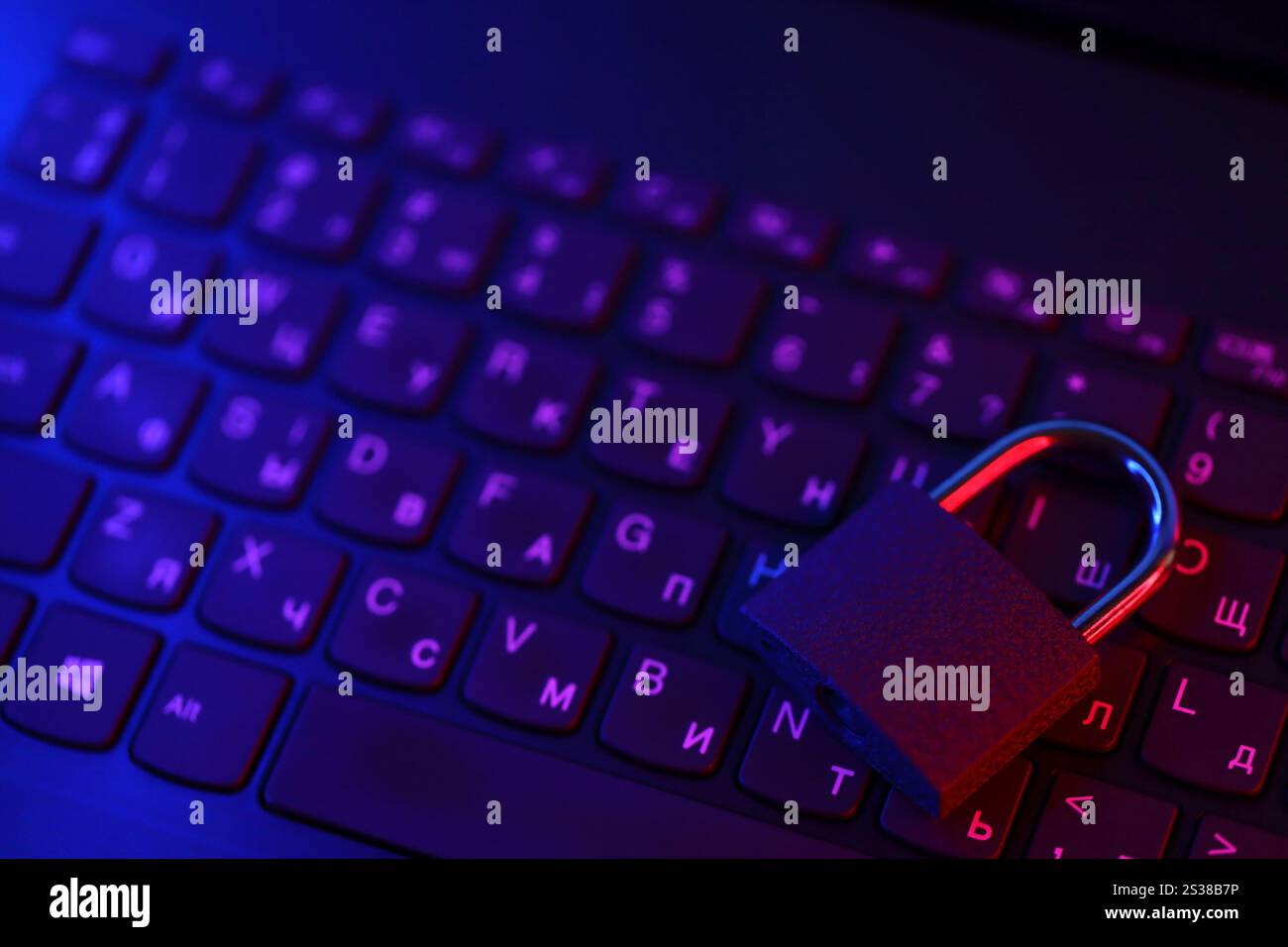 Computer security concept with a closed padlock on the keyboard. Padlock on top of a laptop ...