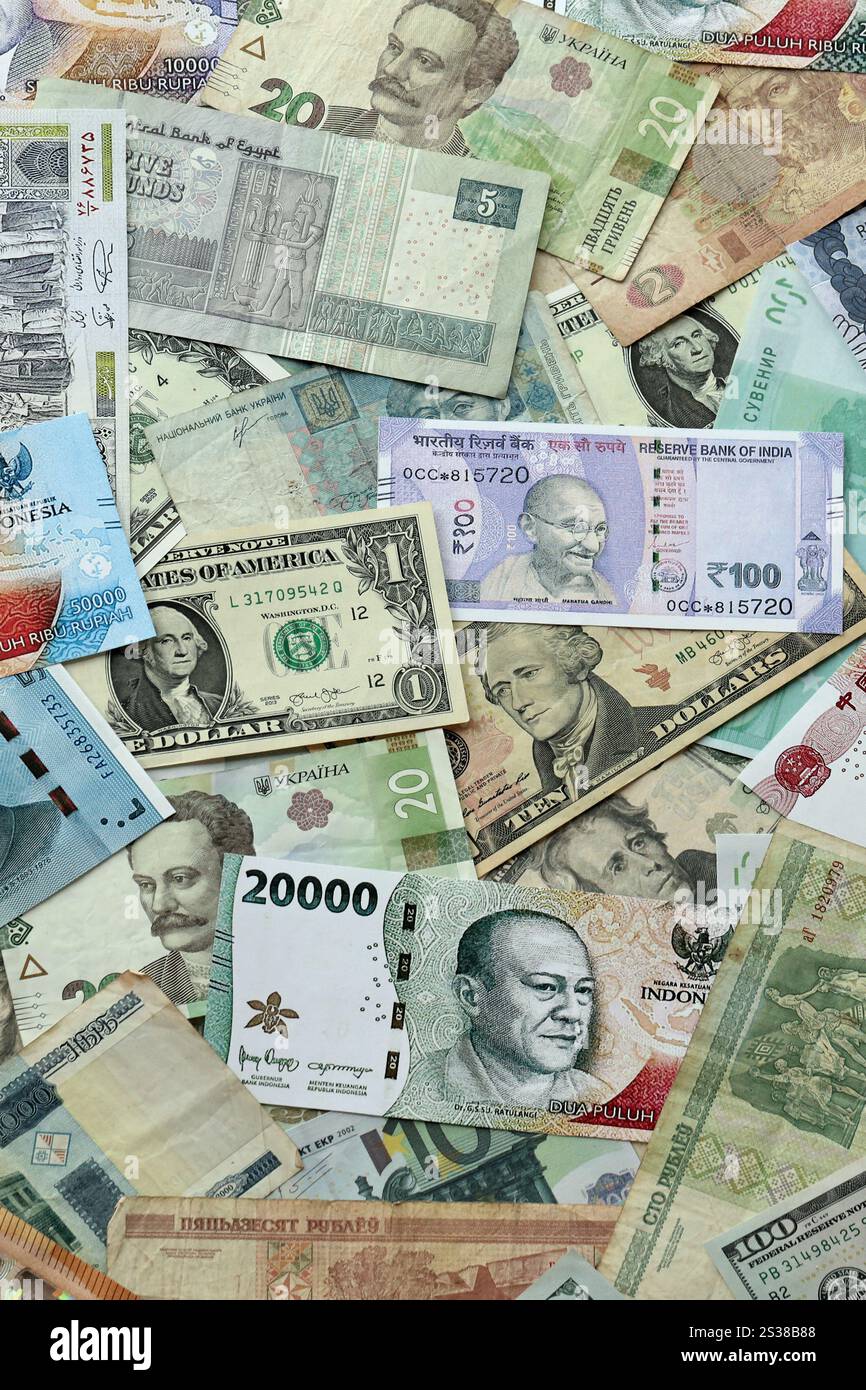 Many banknotes of different currency. Background of big amount of ...