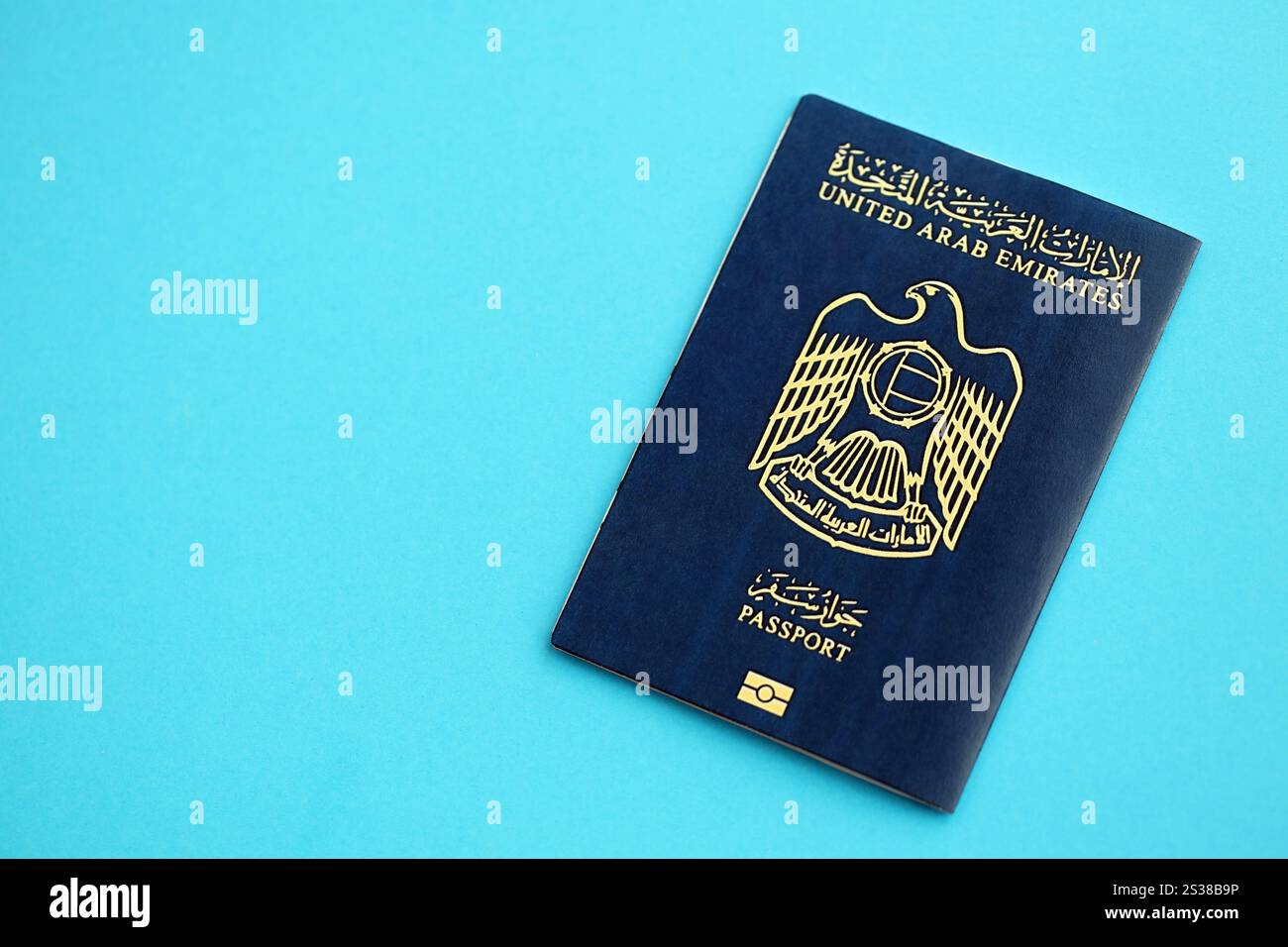 Blue United Arab Emirates passport on blue background close up. Tourism ...
