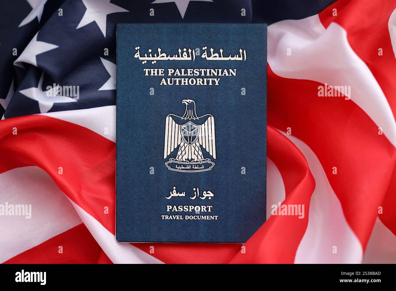 Blue Palestinian Authority passport on United States national flag ...