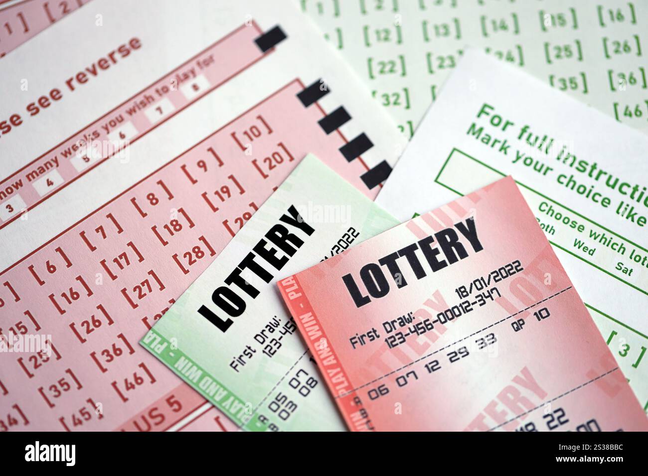 Green and red lottery tickets on blank bills with numbers for playing ...