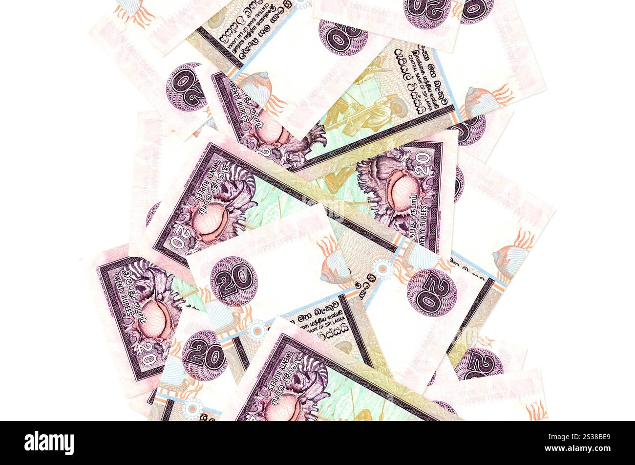 20 Sri Lankan rupees bills flying down isolated on white. Many banknotes falling with white copy ...