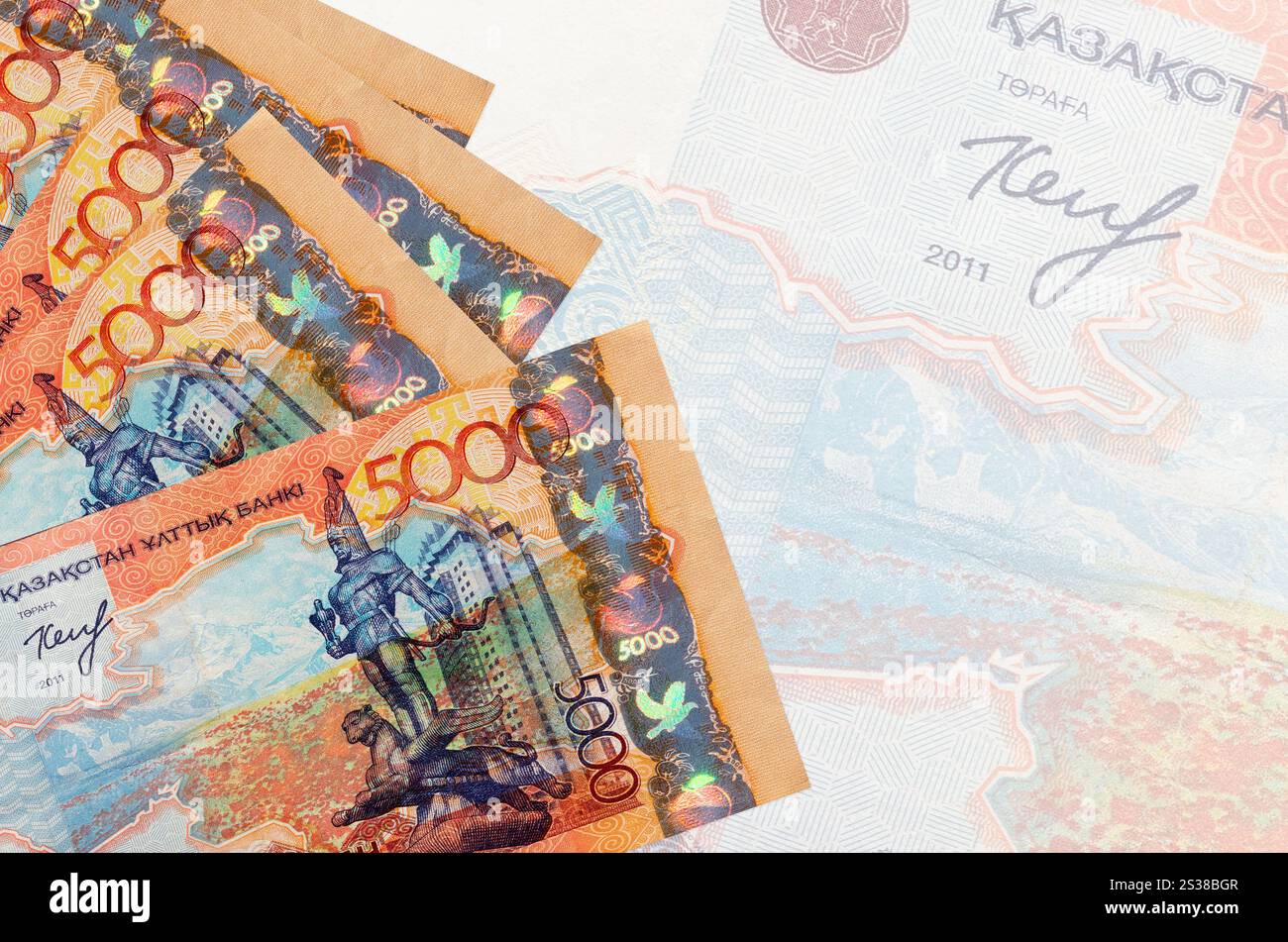 5000 Kazakhstani tenge bills lies in stack on background of big semi ...