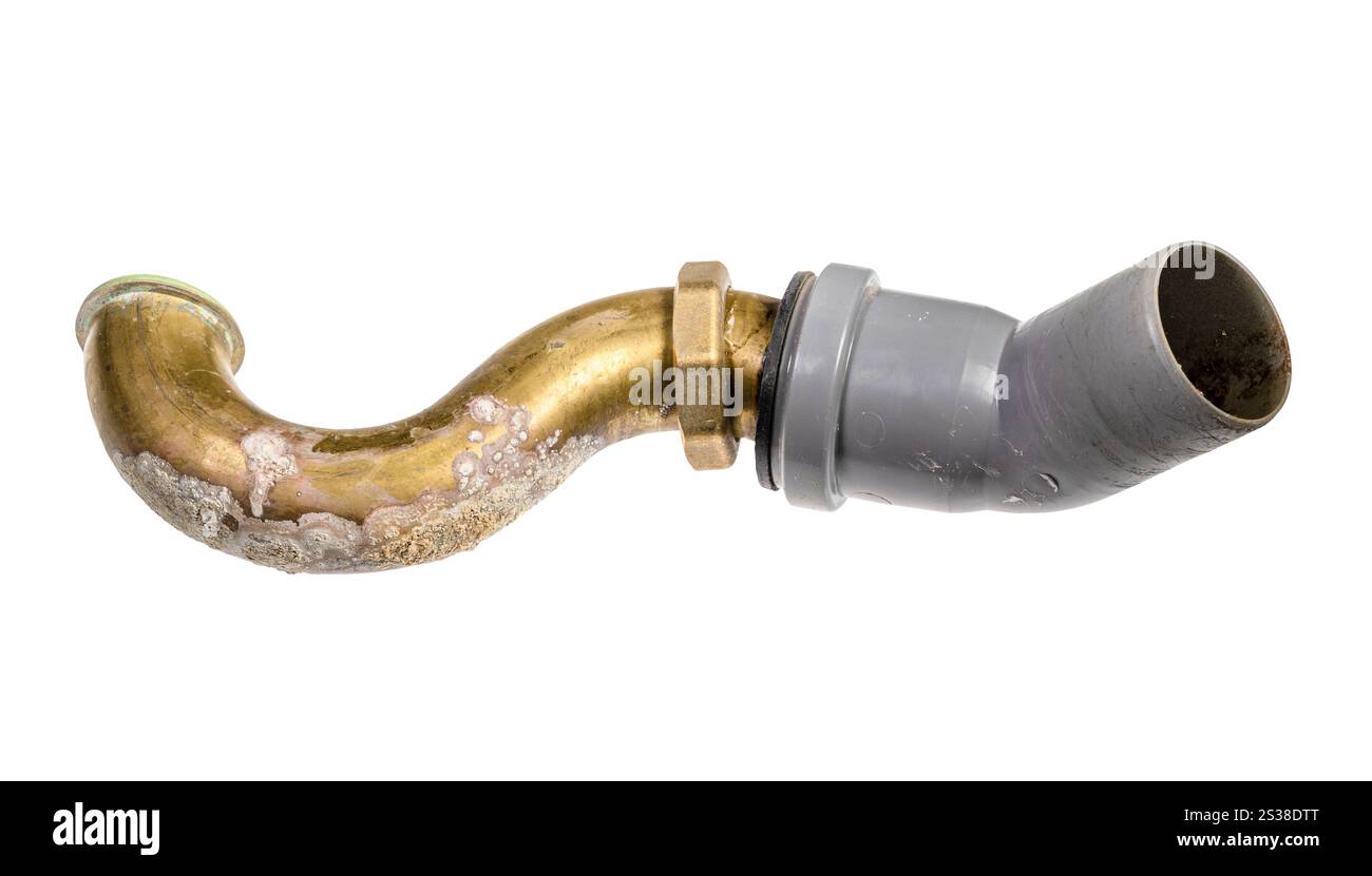 brass bath tub drain covered with corrosion with plastic elbow isolated ...