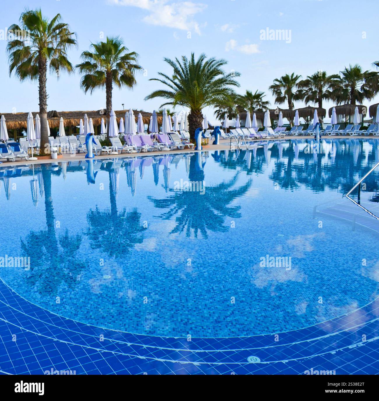 Water pool and chairs - vacation background. Water pool and chairs ...
