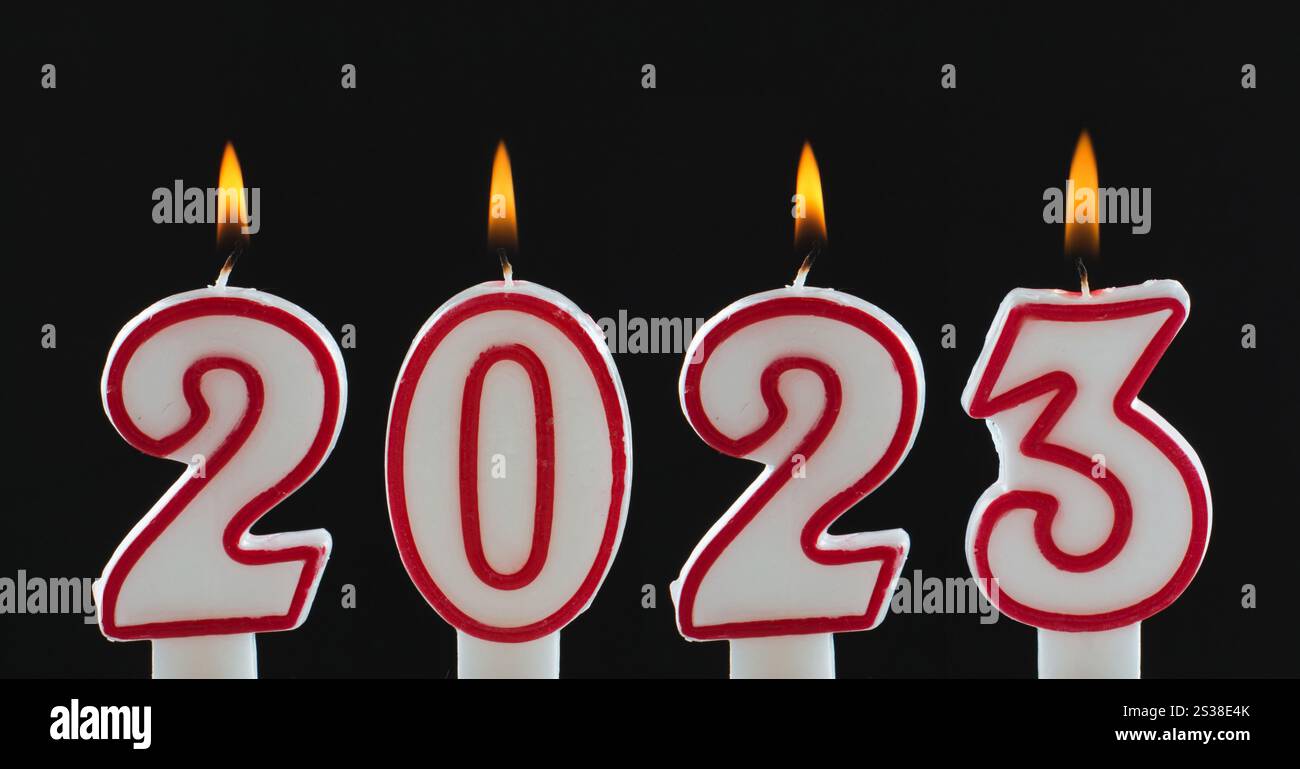 Burning candles for year 2023 Stock Photo - Alamy