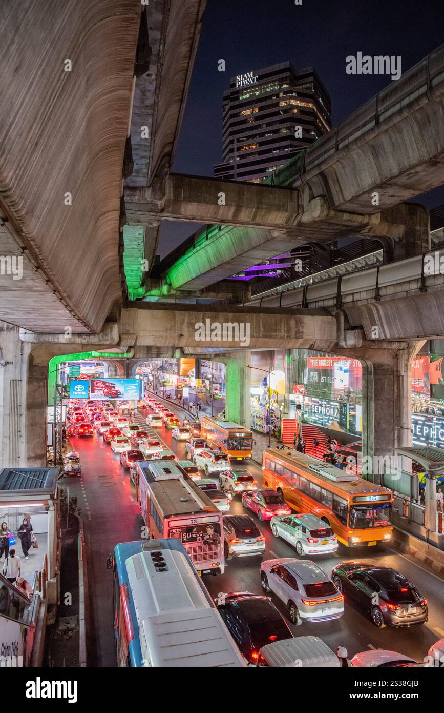 Traffic with cars on the road at the Siam Square in the city of Bangkok ...