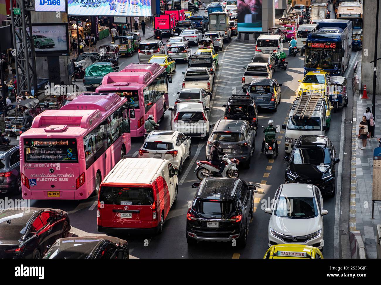Traffic with cars on the road at the Siam Square in the city of Bangkok ...
