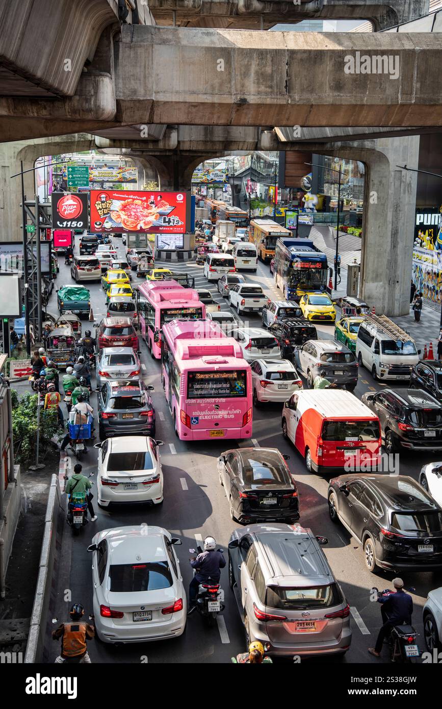 Traffic with cars on the road at the Siam Square in the city of Bangkok ...