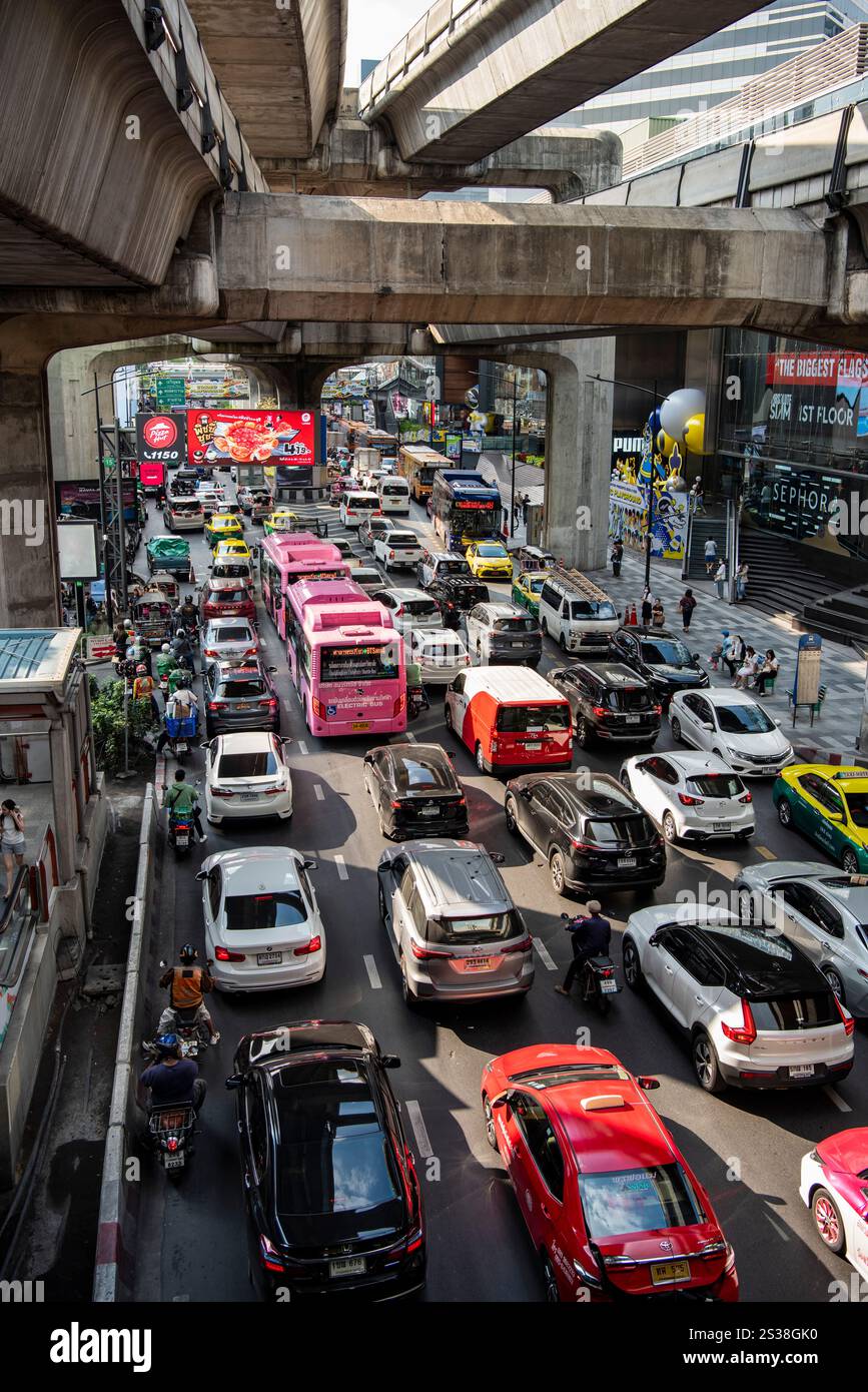 Traffic with cars on the road at the Siam Square in the city of Bangkok ...