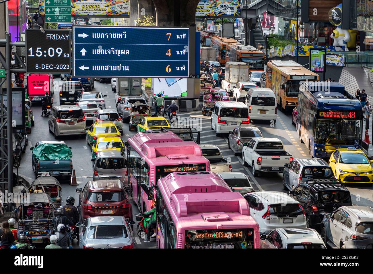 Traffic with cars on the road at the Siam Square in the city of Bangkok ...
