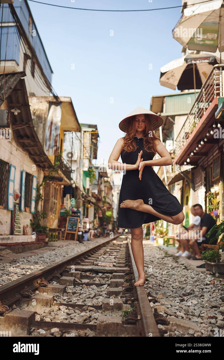 Yoga, straw hat and woman with balance for relax, exercise or grounding ...