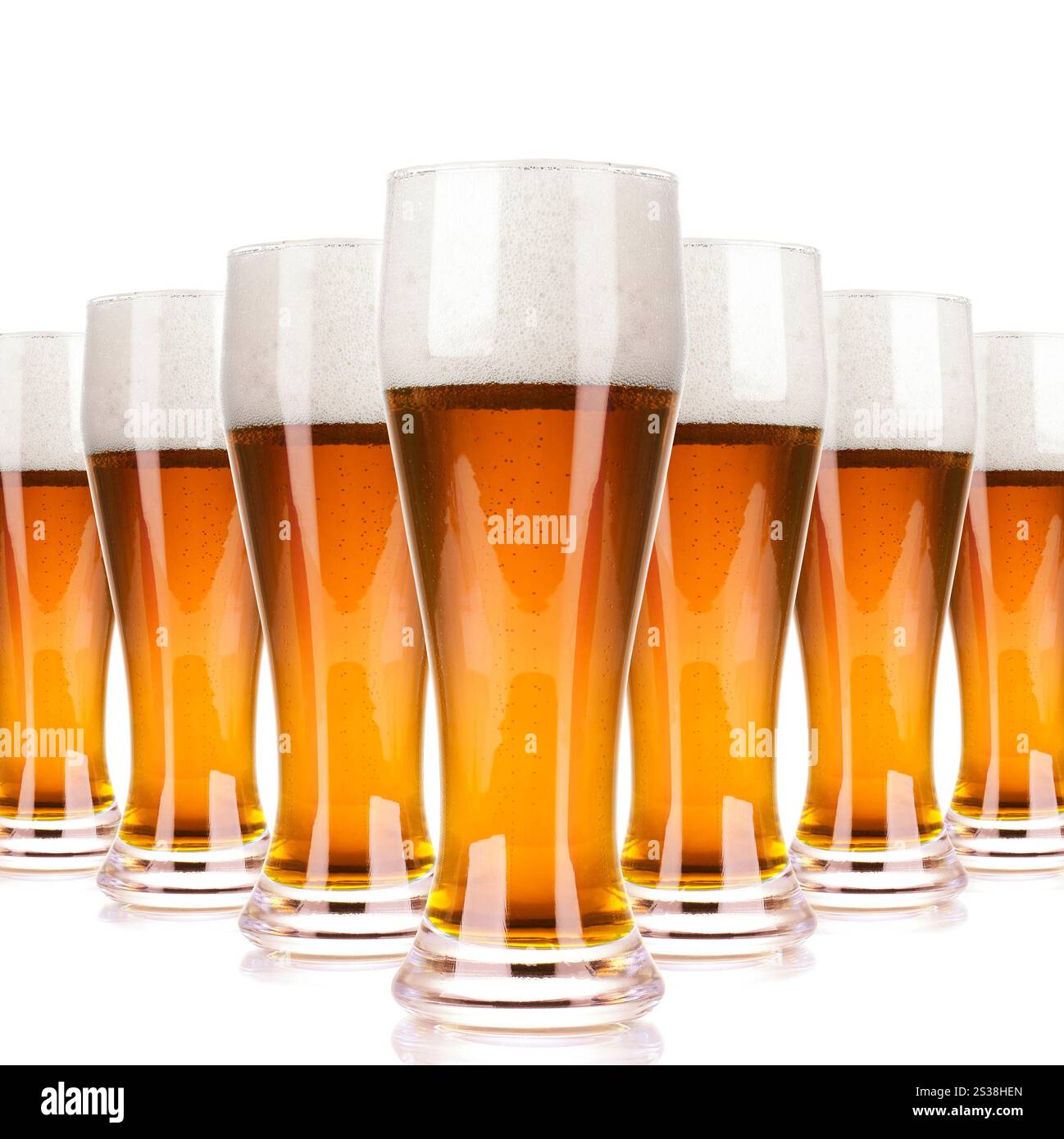 Frosty glass of beer with foam isolated on a white background. Frosty ...