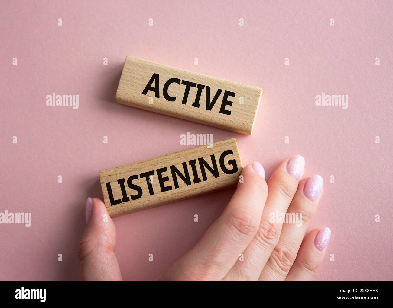 Active listening symbol. Wooden blocks with words Active listening ...