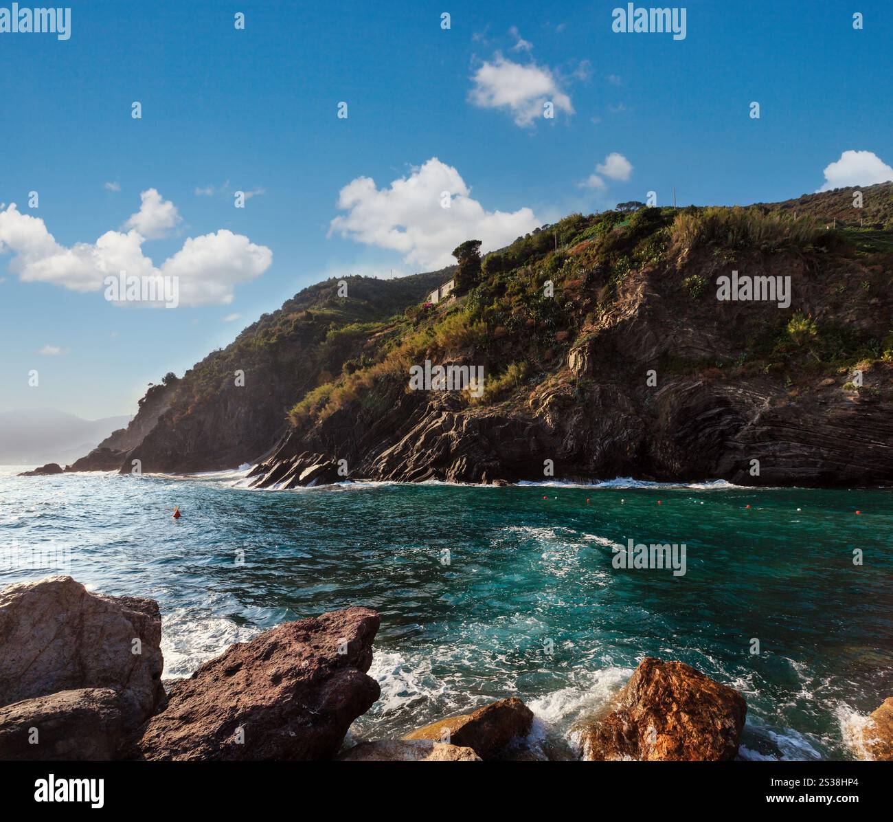 Beautiful evening surf waves and rocky coast in summer Vernazza ...